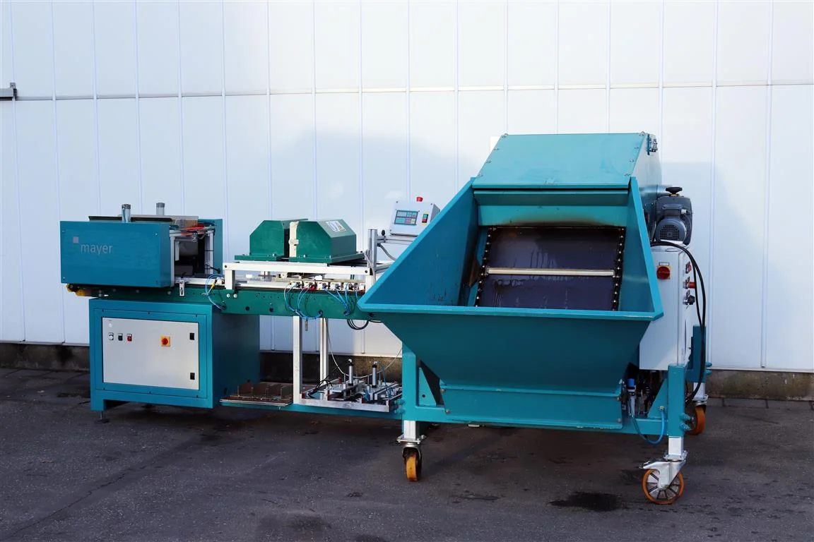 Mayer tray filling machine pot in tray • Duijndam Machines