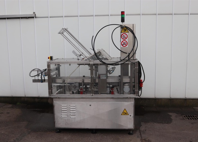 G.Mondini snap on lid machine. • Duijndam Machines