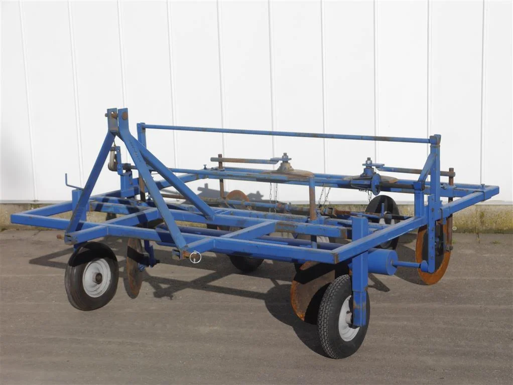 Schrauwen plastic layer machine for depositing plastic over seed beds ...