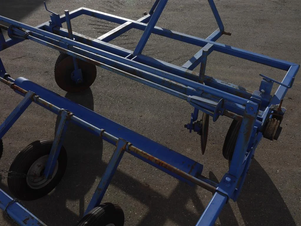 Schrauwen plastic layer machine for depositing plastic over seed beds ...